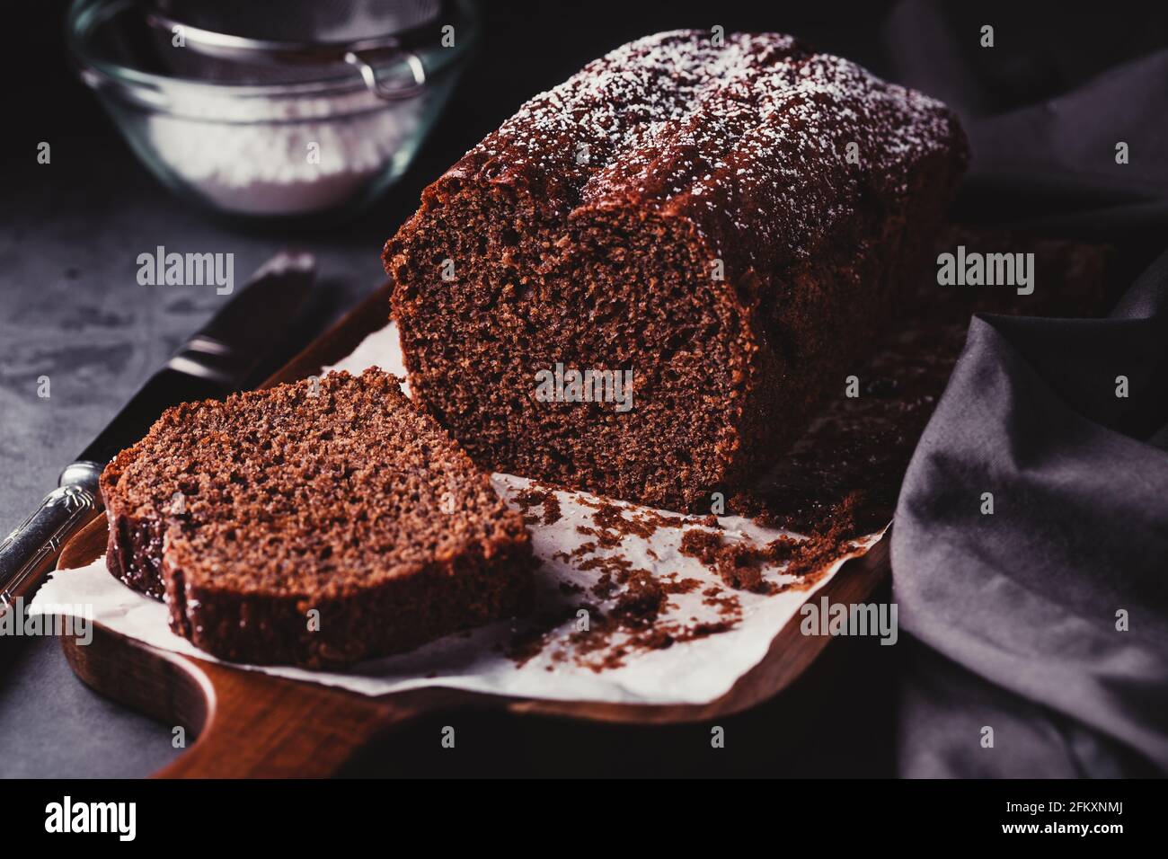 Chocolate cake on cutting table Stock Photo - Alamy
