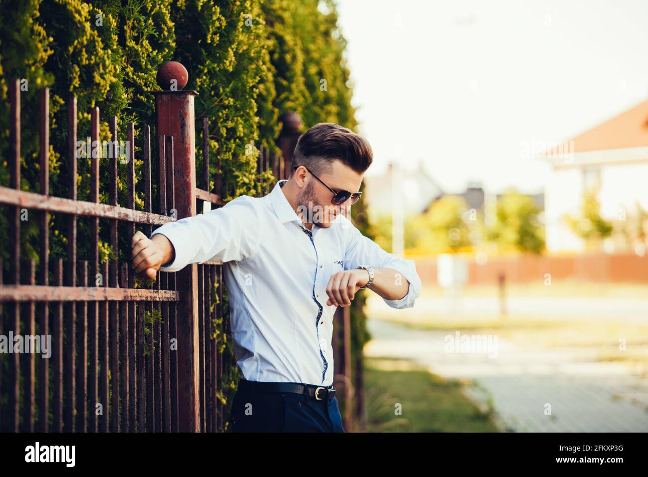 Hand men looking watch time hi-res stock photography and images - Alamy