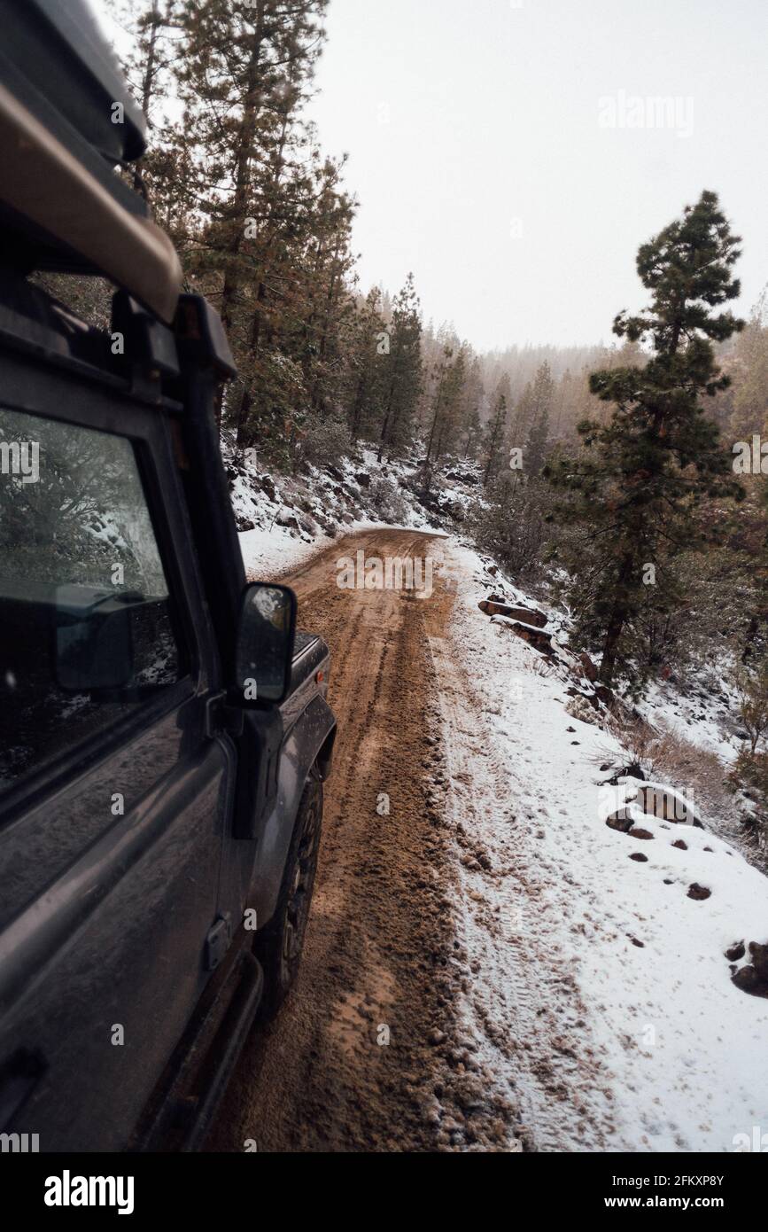 4x4 driving across snowy and icy road in Tenerife Stock Photo - Alamy