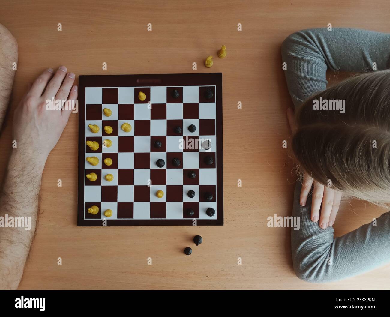 two players are thinking while playing chess top view Stock Photo - Alamy