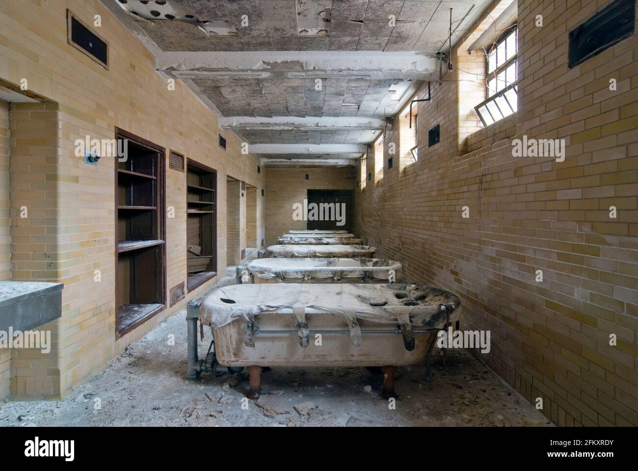 Interior of an abandoned decaying mental hospital Stock Photo - Alamy
