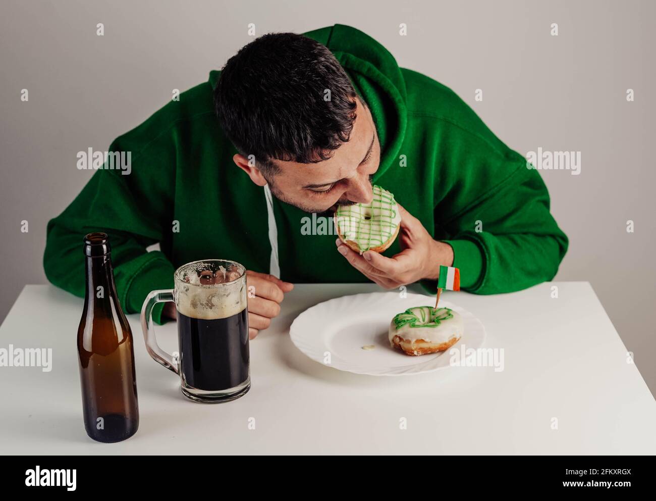 A single man having donuts and stout for breakfast to celebrate St ...