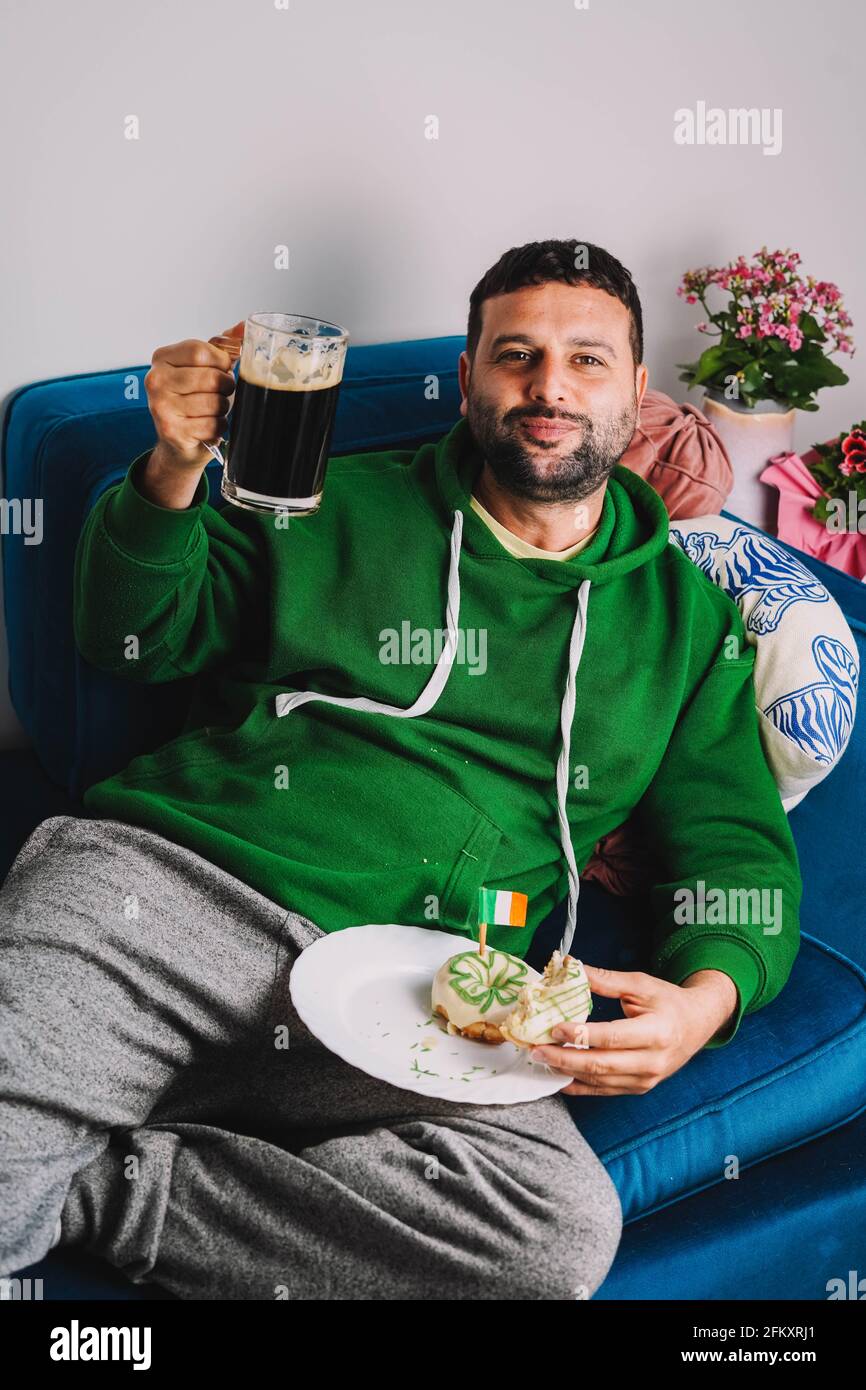 A single man having donuts and stout for breakfast to celebrate St ...