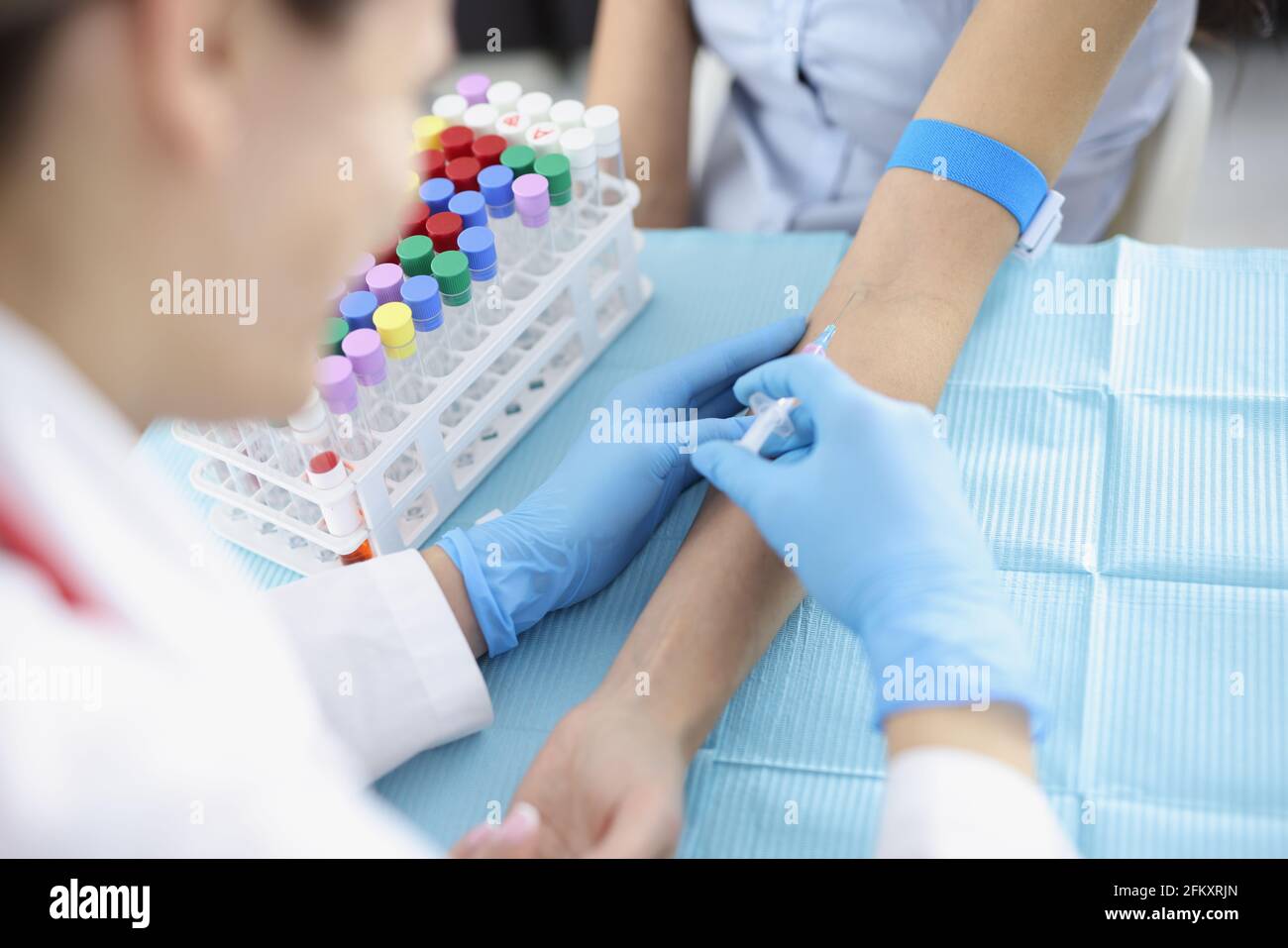 Doctor injects patient into a vein closeup Stock Photo - Alamy