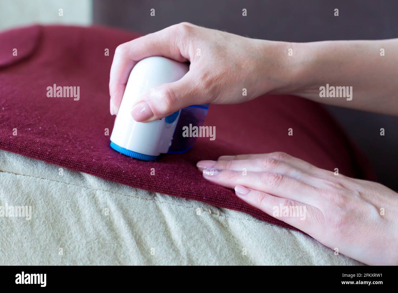 Woman removing her sweater hi-res stock photography and images - Alamy