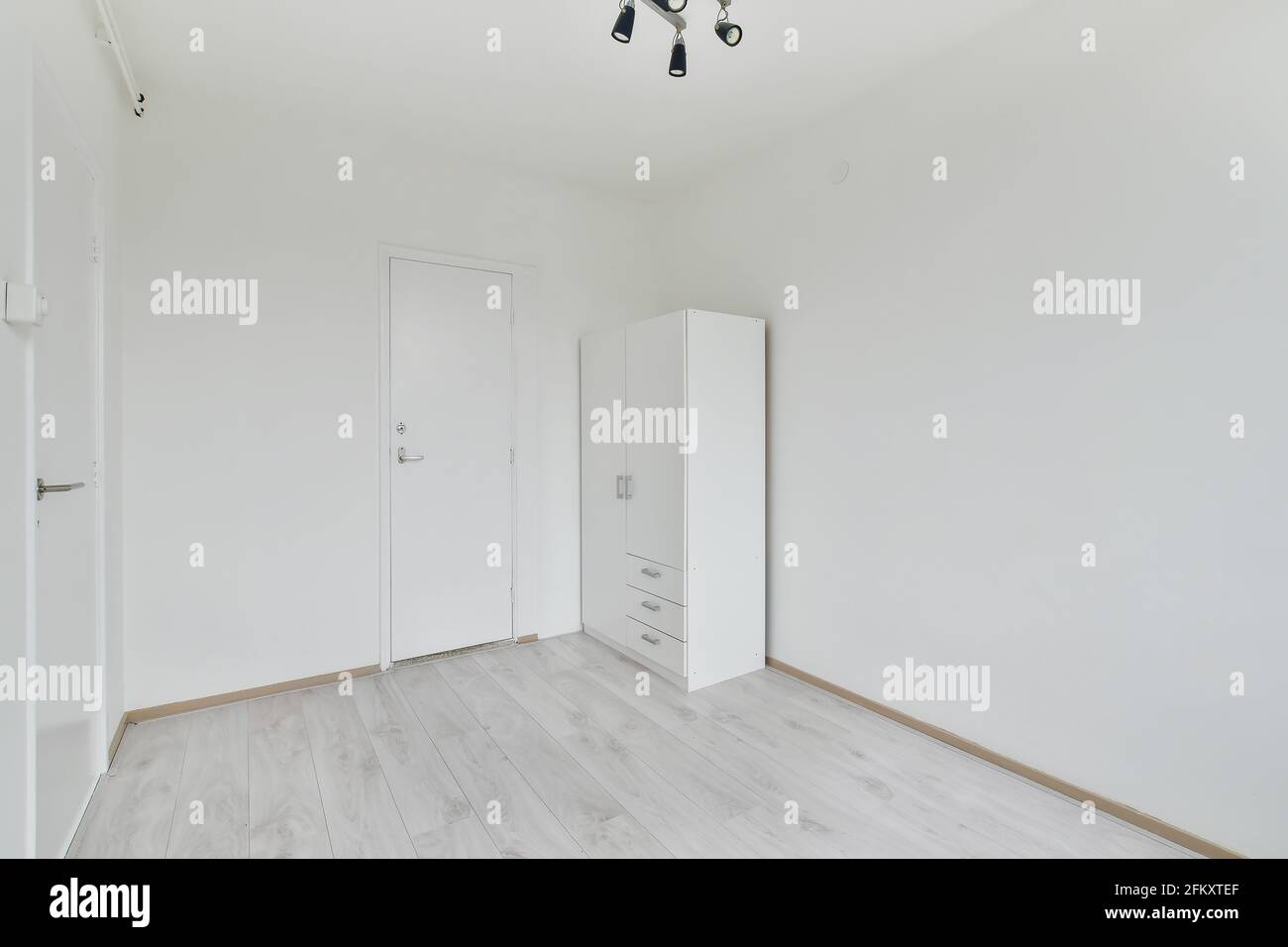 Simple empty white room in apartment Stock Photo - Alamy