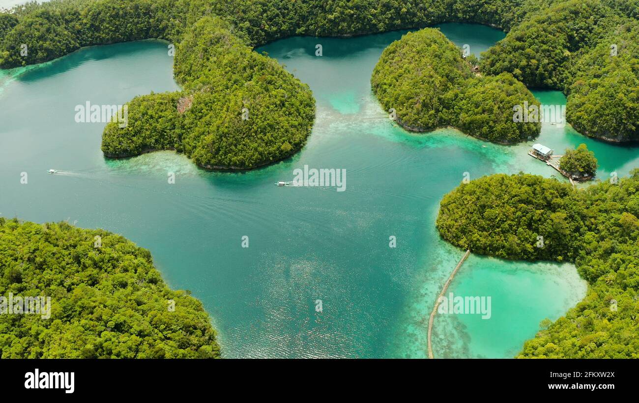 Beautiful tropical lagoon with blue water in bay surrounded by islands ...