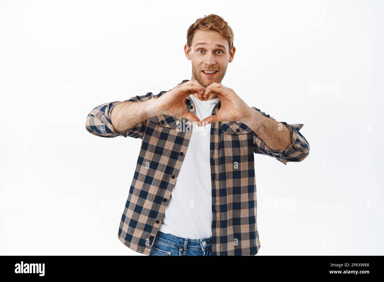 Cute boyfriend showing heart sign, man with I love you gesture trying ...