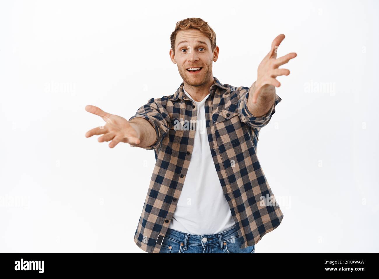 Come here. Smiling redhead man stretch out hands, reaching for you ...