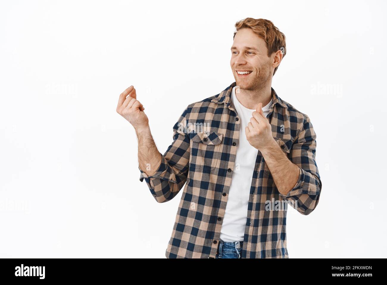 Smiling man dancing and snap fingers and having fun, dance and look ...