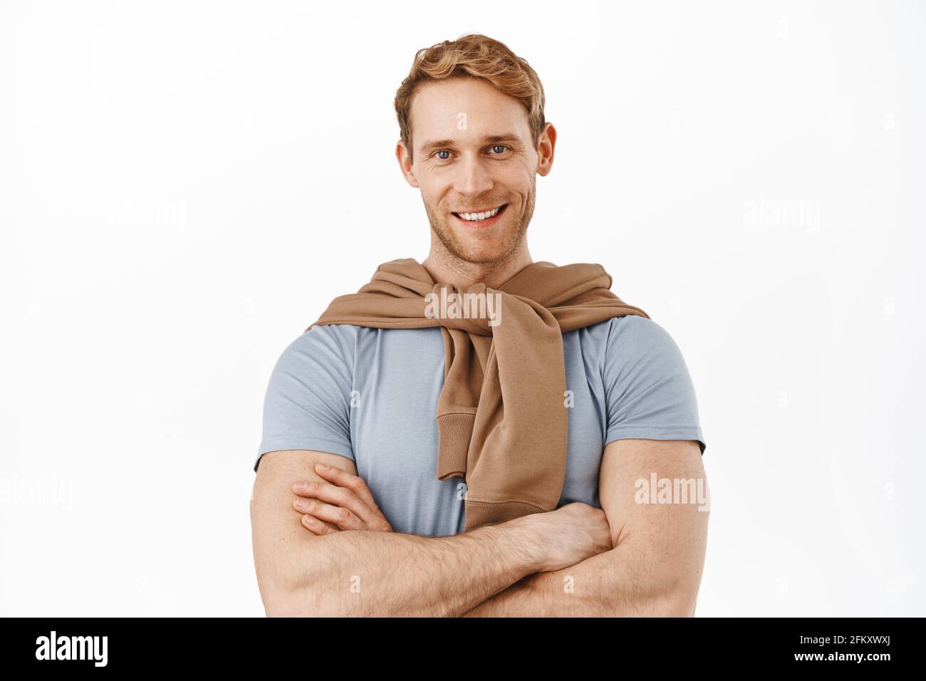 Confident ginger man with strong masculine body, sportsman in casual ...