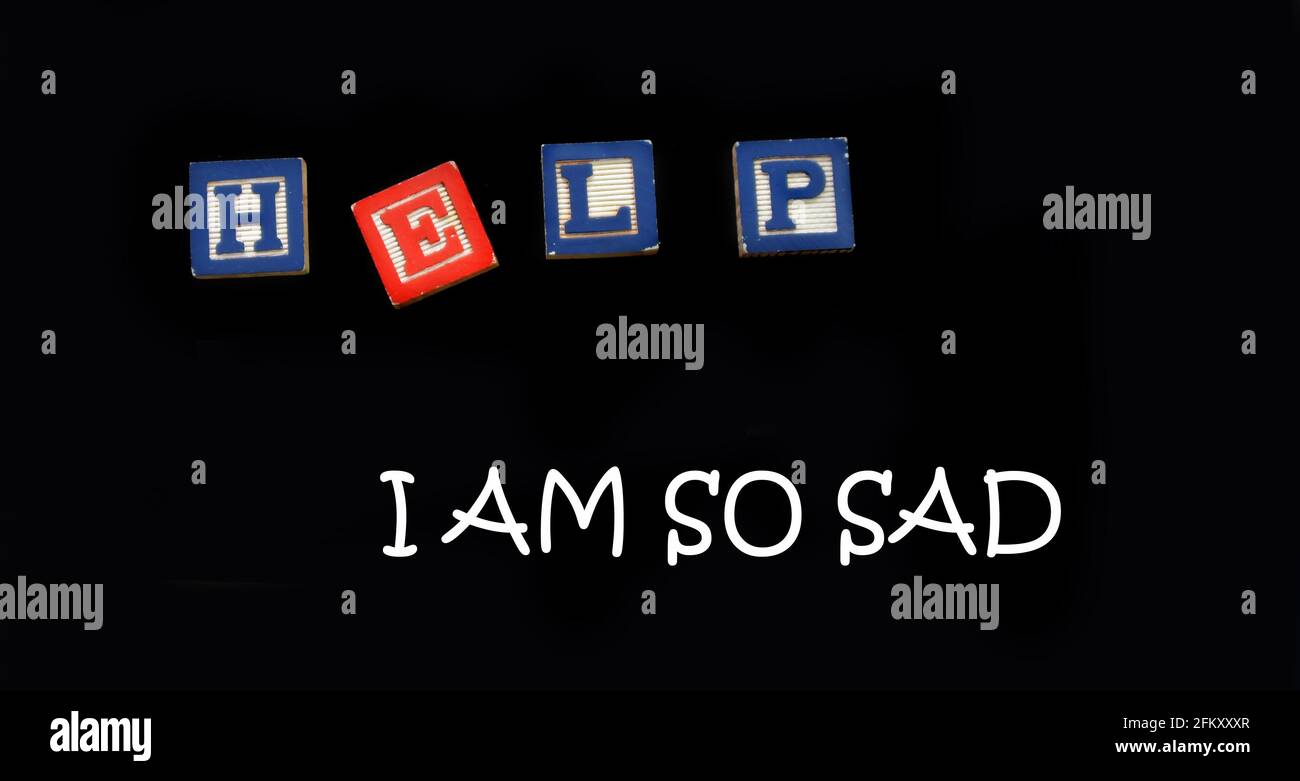 Wooden block letters spell the word help with a message that says I am ...