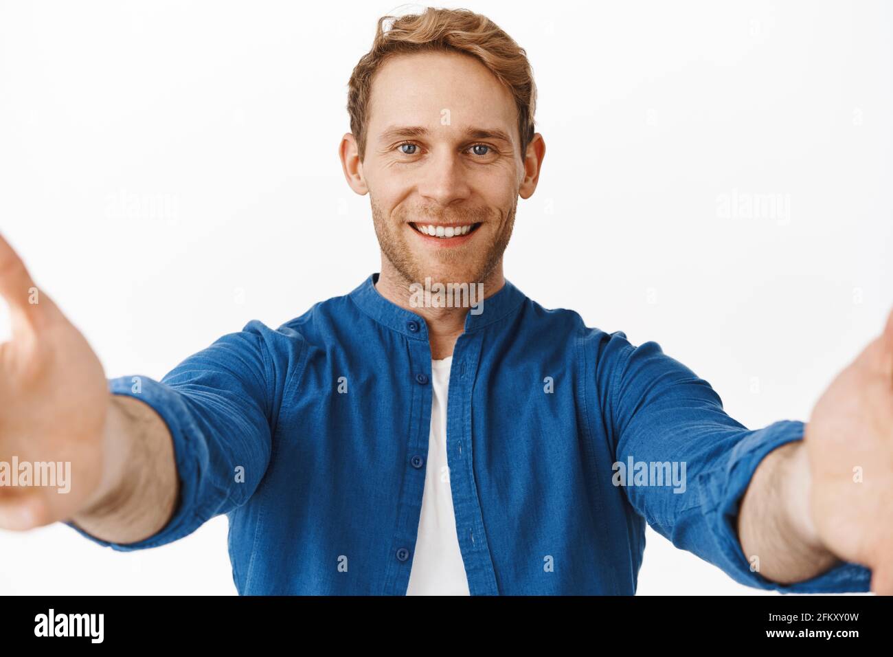 Handsome redhead man smiling, talking on video call conference and ...