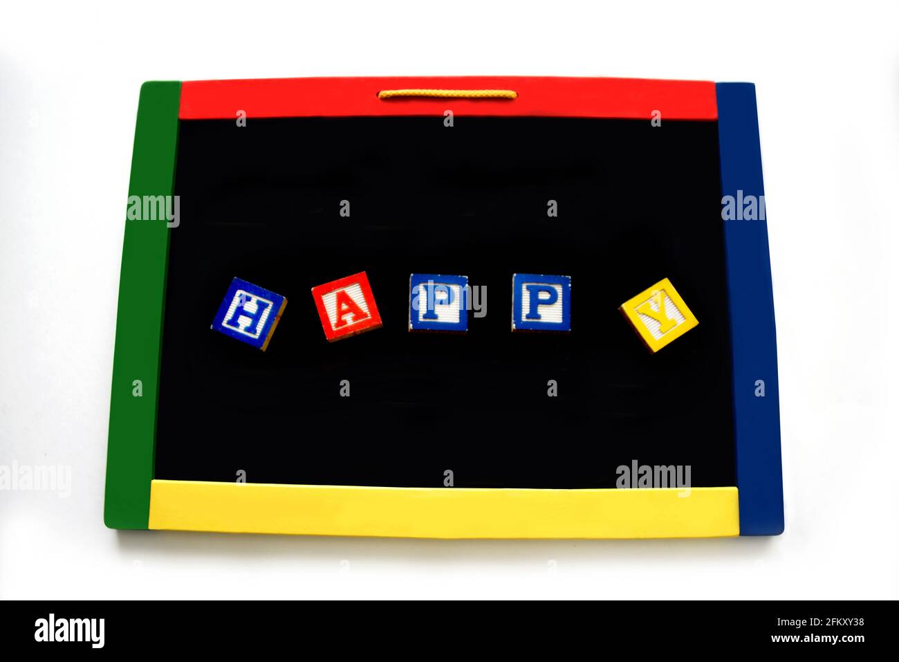 Wooden block letters spell the word happy on a magnetic board. Image ...