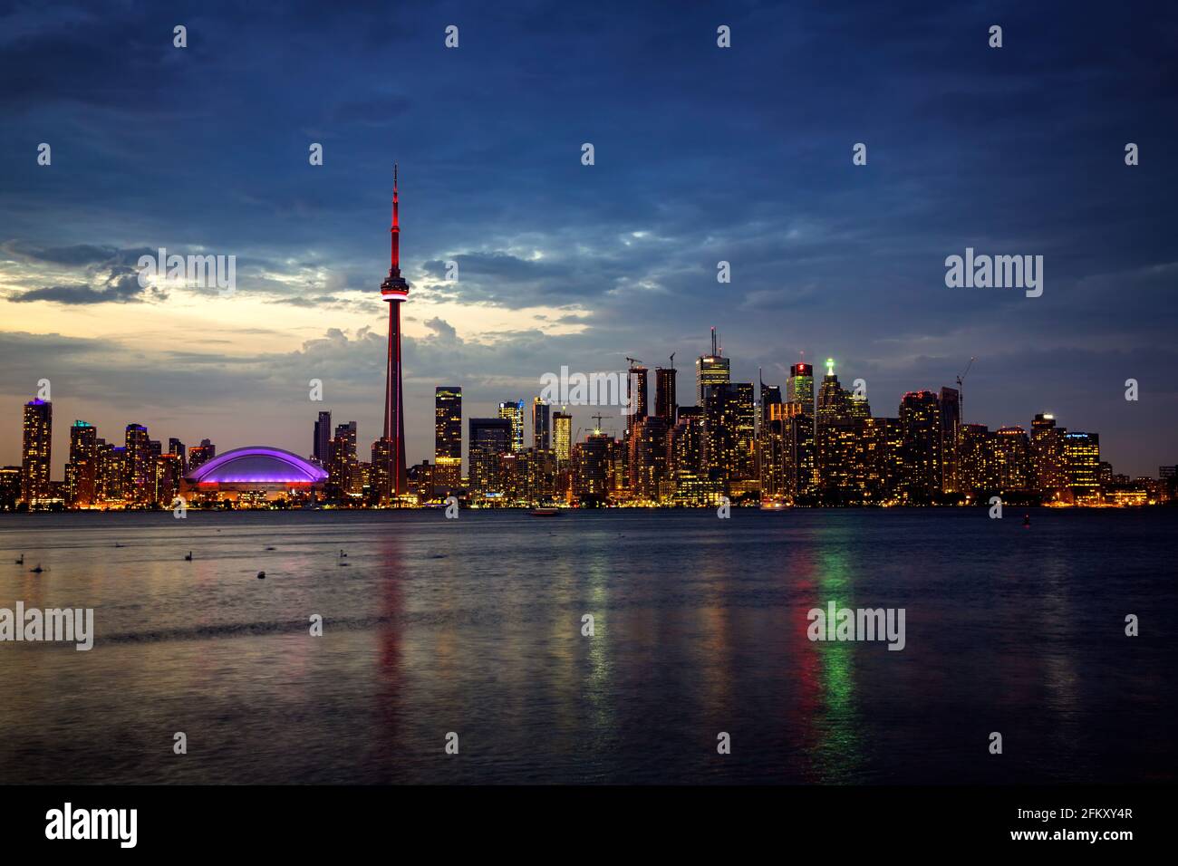 The Toronto skyline in the early evening blue hour light, seen from ...