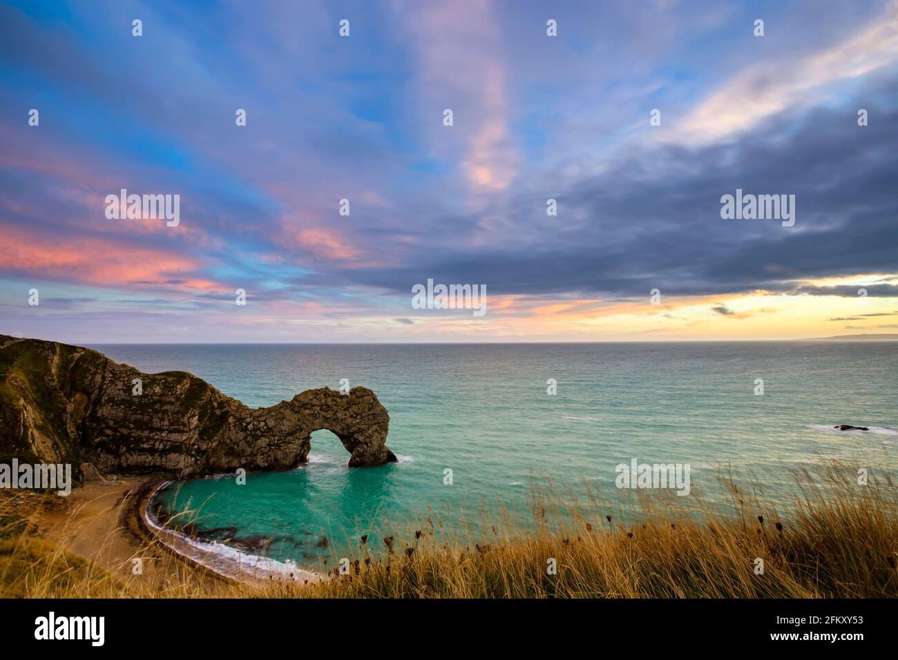 Sunset at Durdle Door, the iconic natural limestone arch on the ...