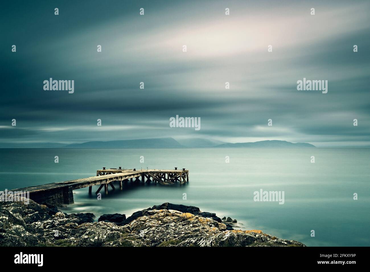Long exposure of the old concrete pier at Portencross on the North ...