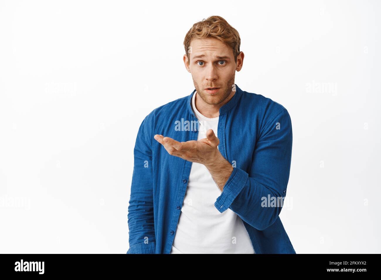 What is that. Confused redhead man pointing at something strange ...