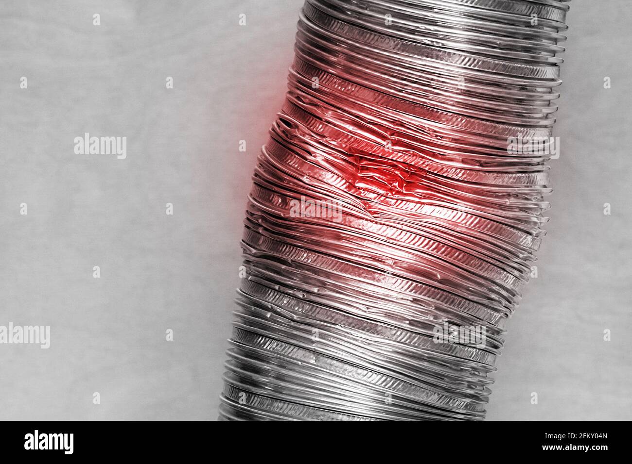 Ventilation damaged pipe system in an industrial plant, close-up of a ...