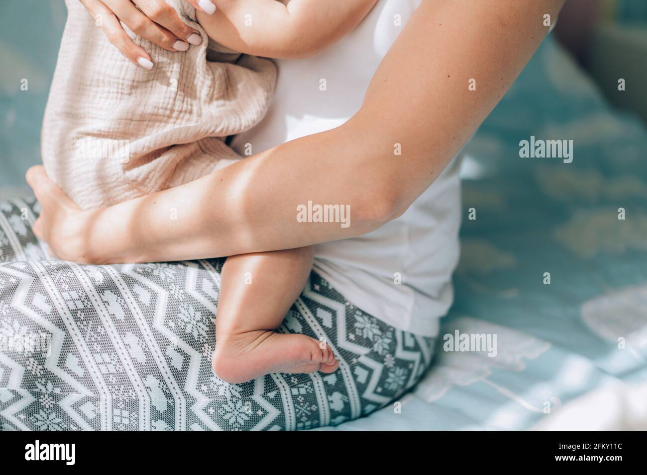 Young mother is breastfeeding her baby. In Vitro Fertilization IVF ...