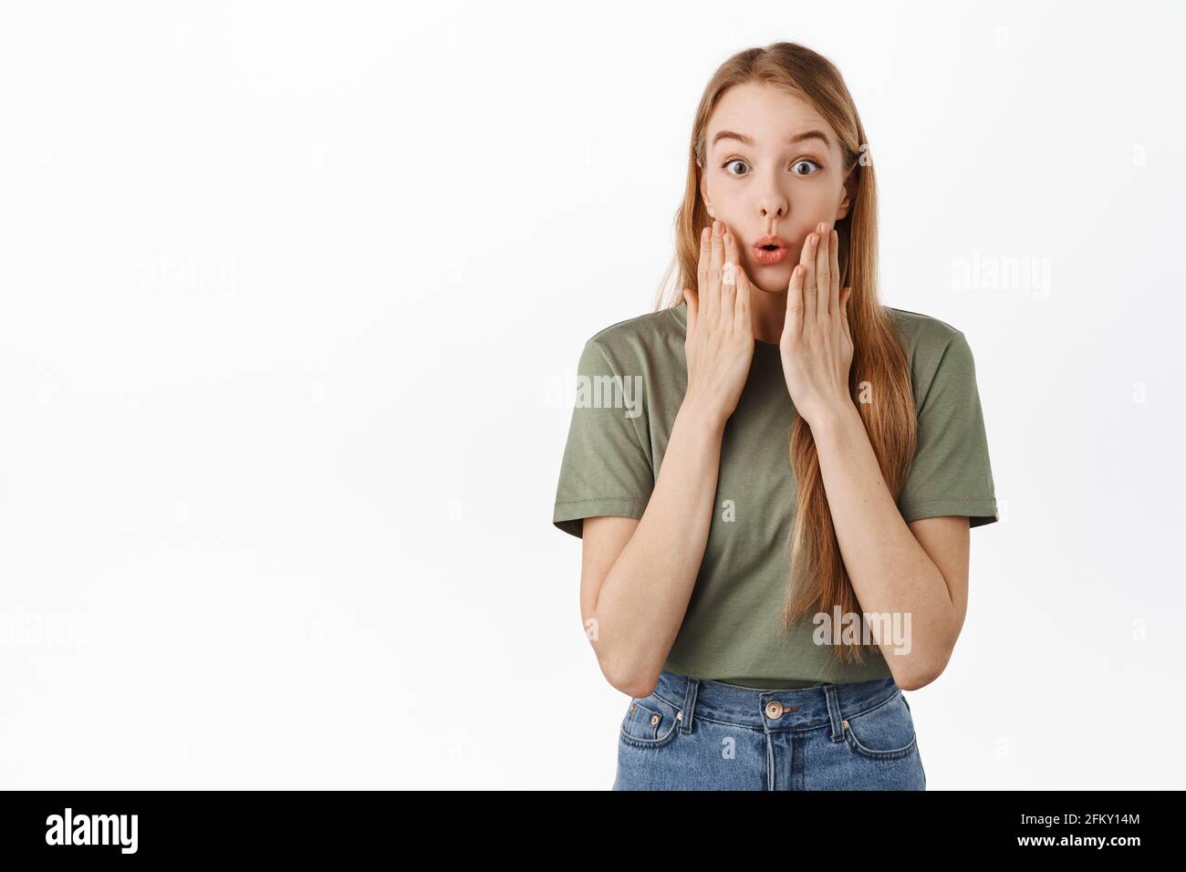 Amazed And Impressed Blond Girl Gasping Fascinated Holding Hands Near