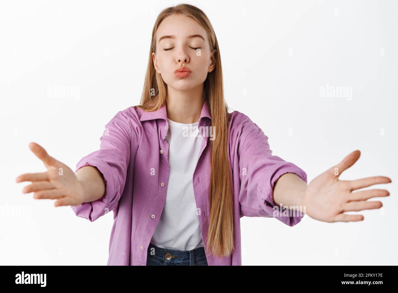 Cute girl lean closer to hug and kiss you. Young romantic woman close ...