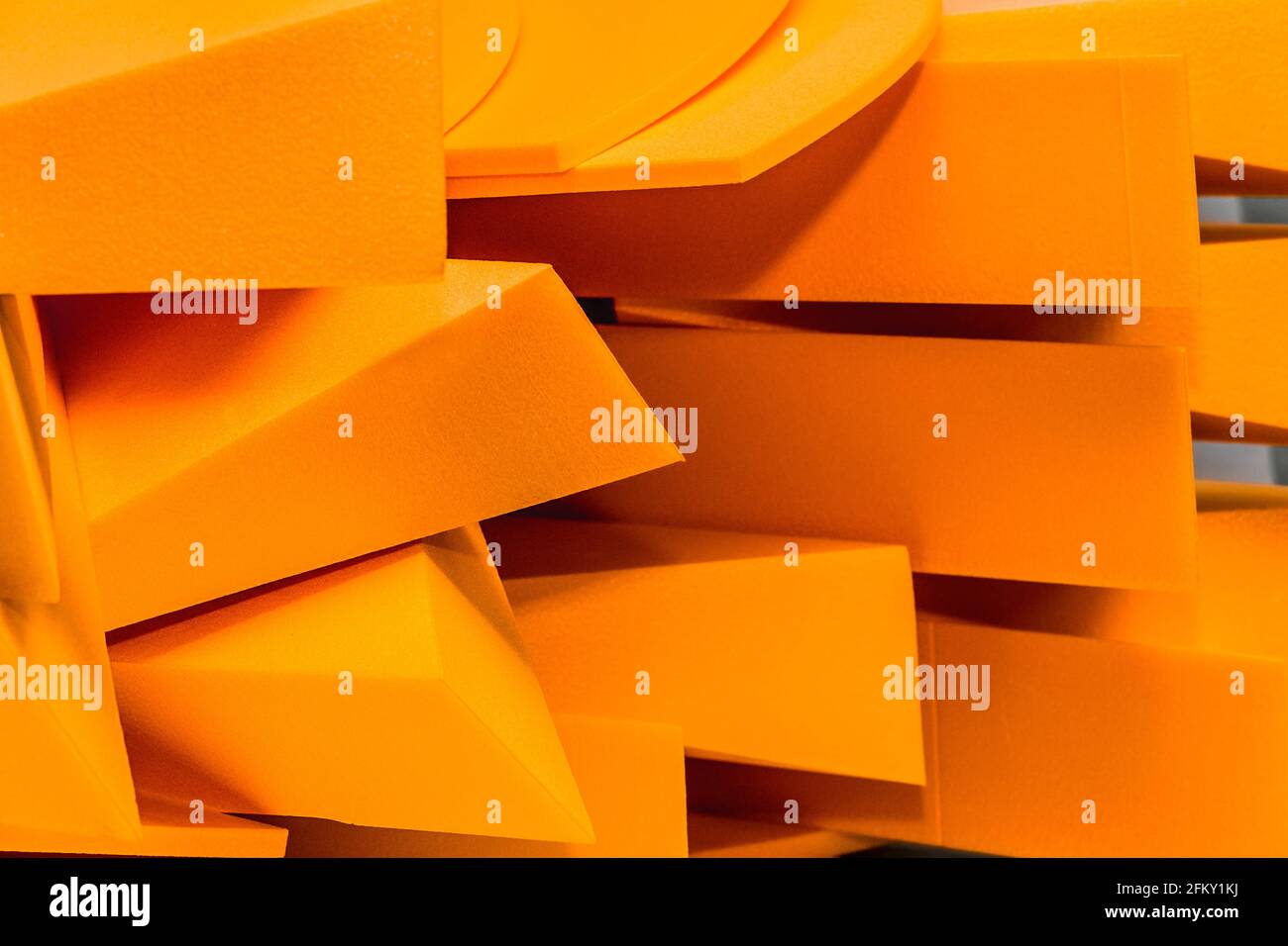 A pile of color orange polystyrene industrial foam material storage on ...