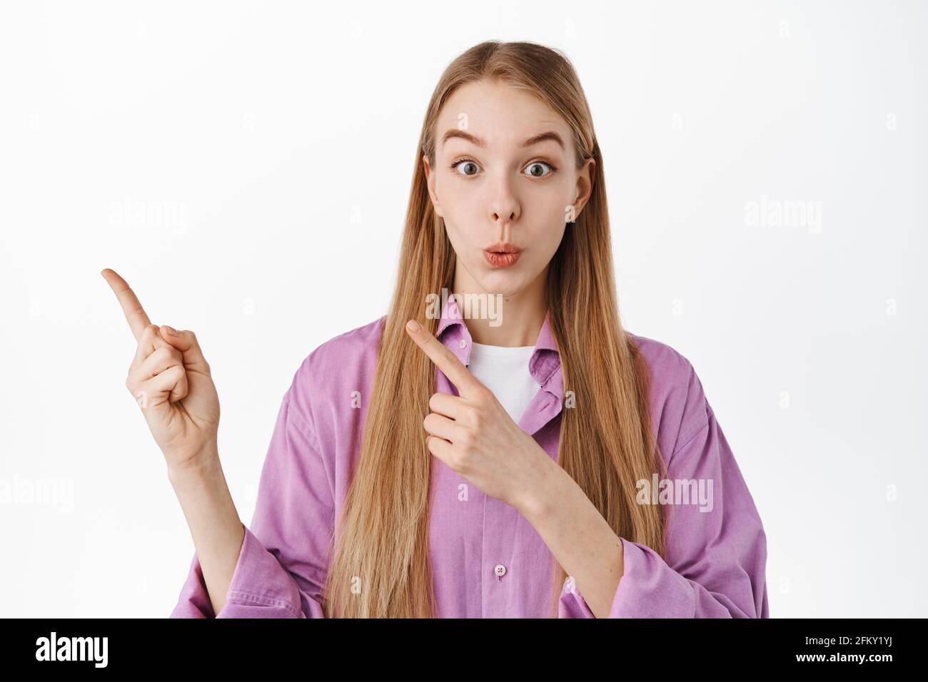 Wow look there. Excited blond girl seeing interesting promo logo ...