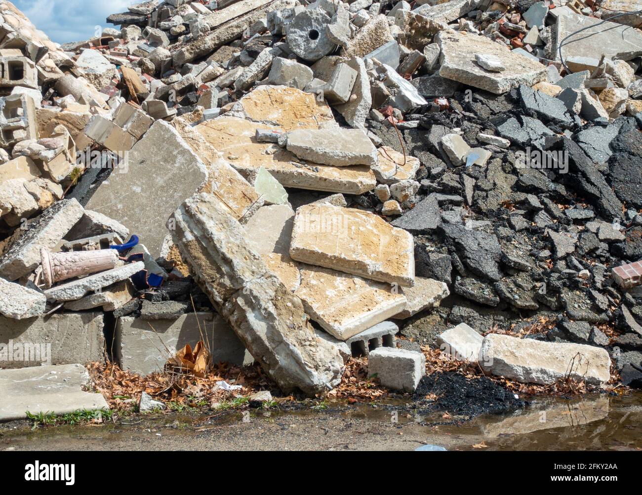 Concrete, Asphalt and Brick demolition waste area and sand hill at ...