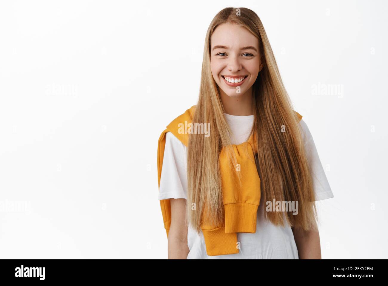 Beautiful young woman with natural blond long hair flying in air, girl ...