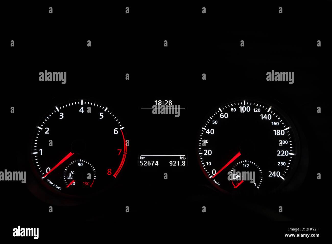 Car speedometer dashboard lit up in the dark. Engine start ...