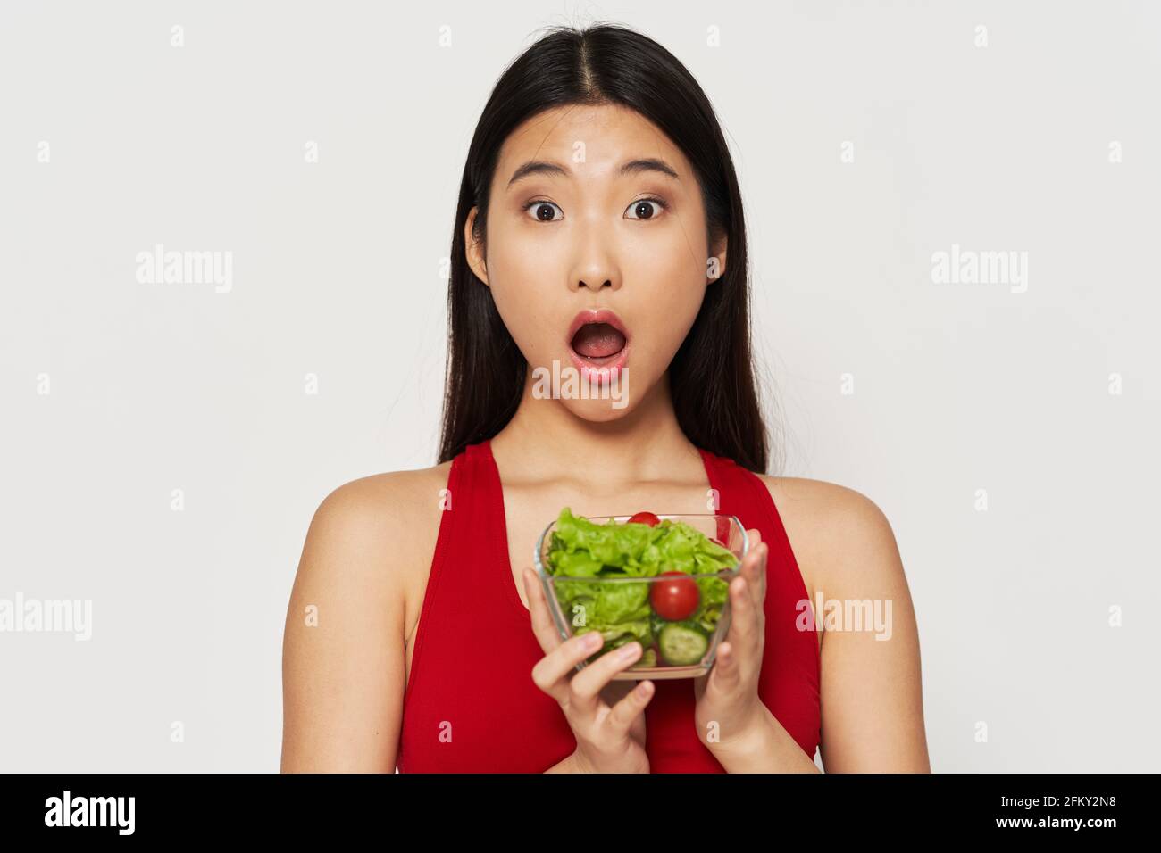 woman of asian appearance plate with salad healthy food Stock Photo - Alamy