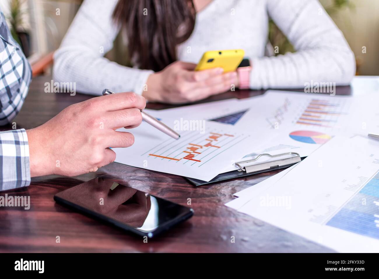 Business people discussing graph hi-res stock photography and images ...