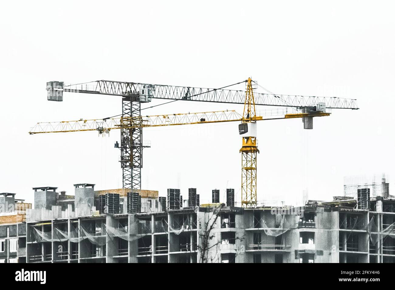 Construction tower industrial cranes on site. Building design ...