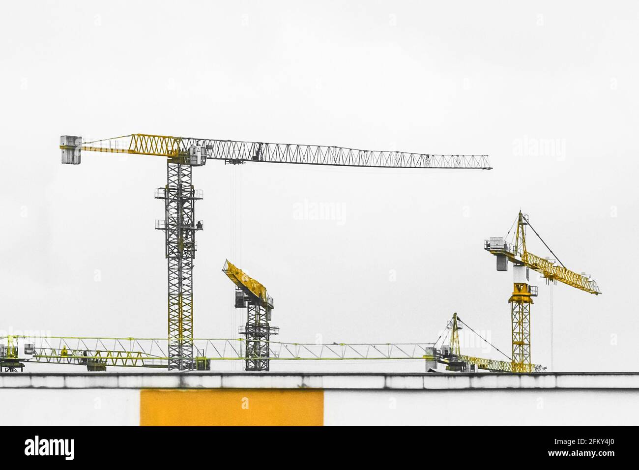 Construction tower industrial cranes on site. Building design ...