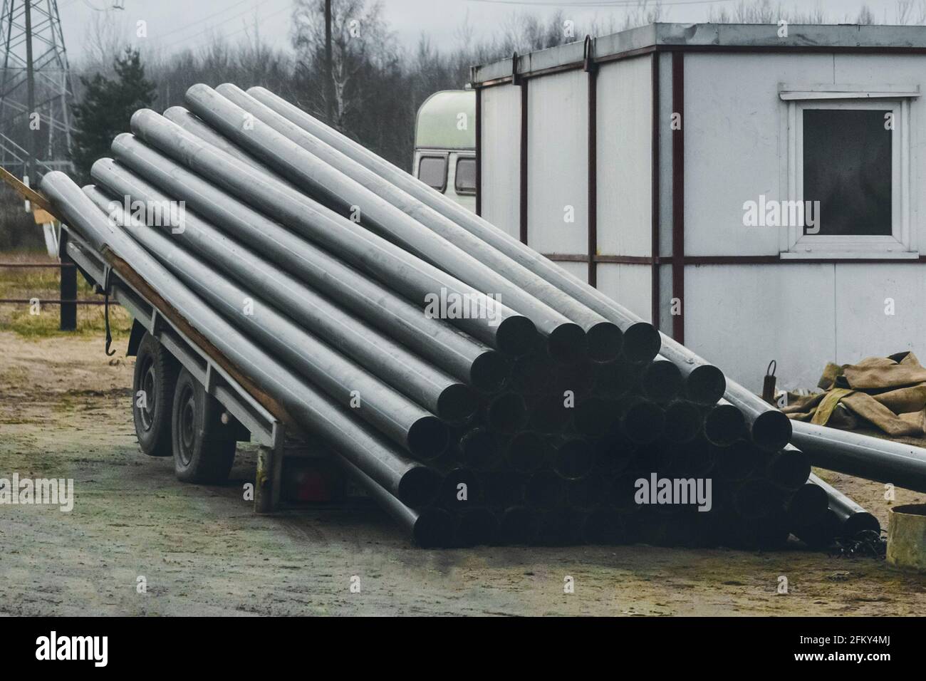 A pile of polyethylene pipes industrial materials loaded and storage ...