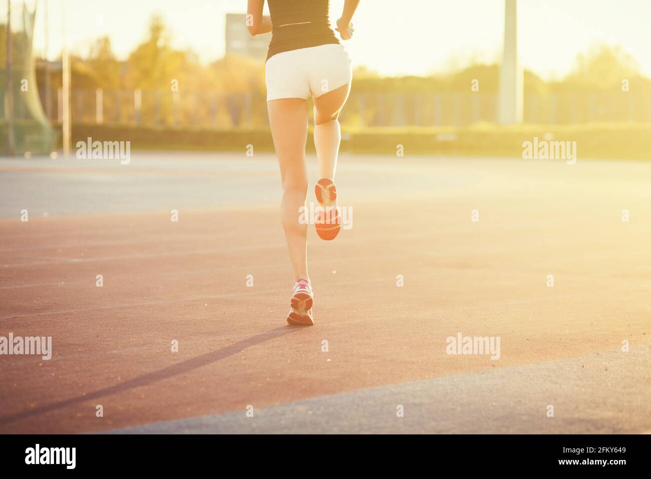 young woman runner running on stadium outdoor Stock Photo - Alamy
