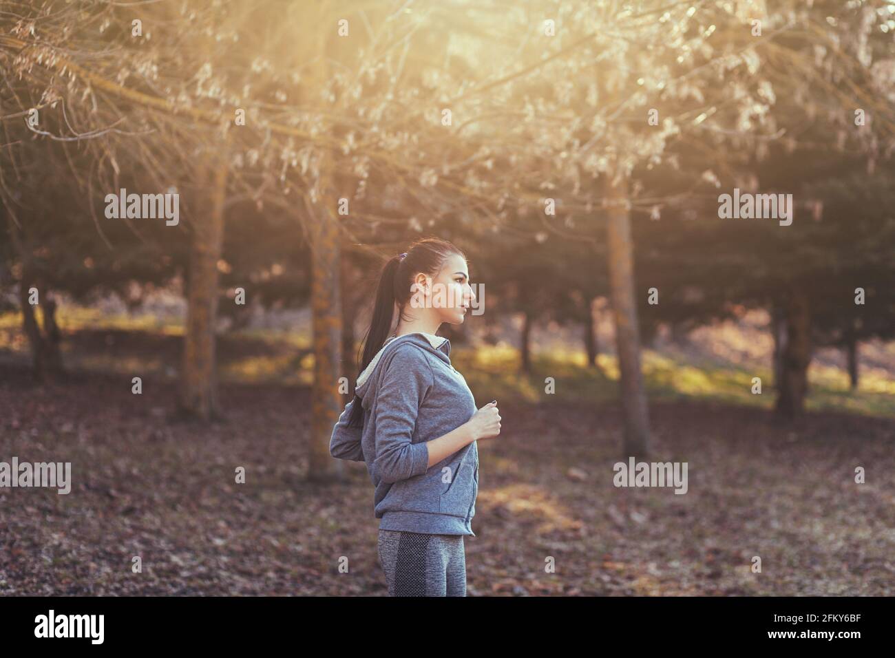 Runner woman jogging in autumn park. Beautiful young fit fitness sport ...