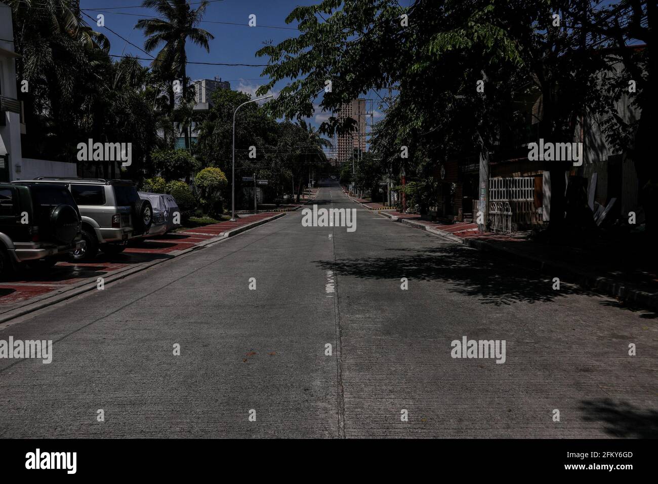 An empty street as people stay inside their homes during a community ...
