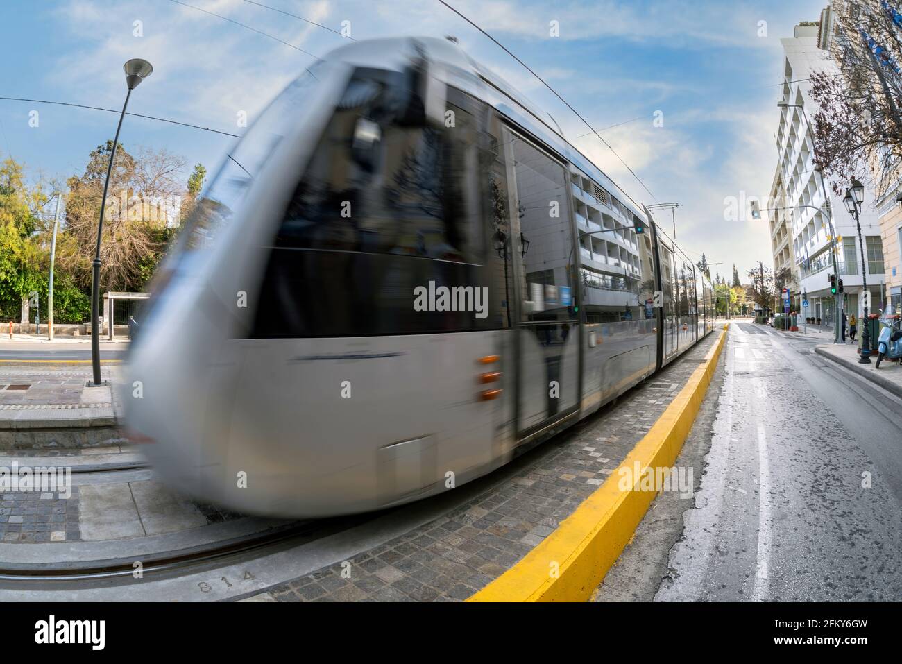 The Athens city tram train is approaching the central station at ...