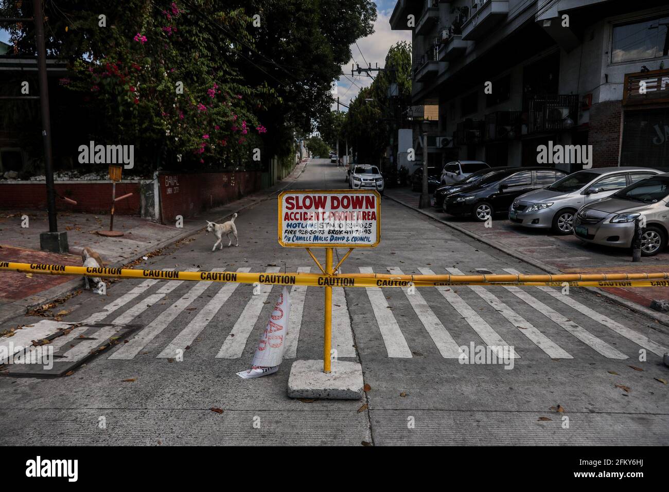 An empty street as people stay inside their homes during a community ...