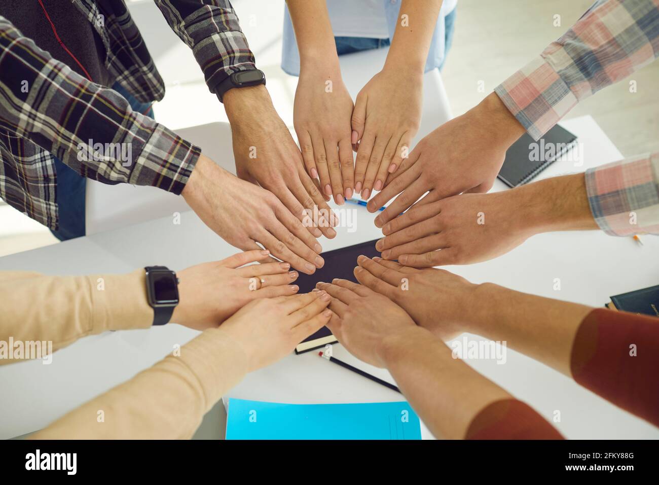 Young people group make shape of circle from palms joining together top ...