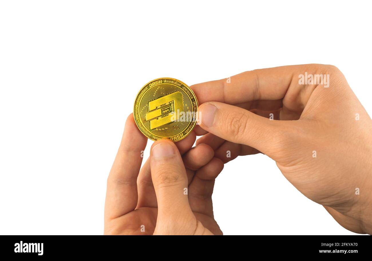 Man holds one Dash coin in hand isolated on white background, crypto ...