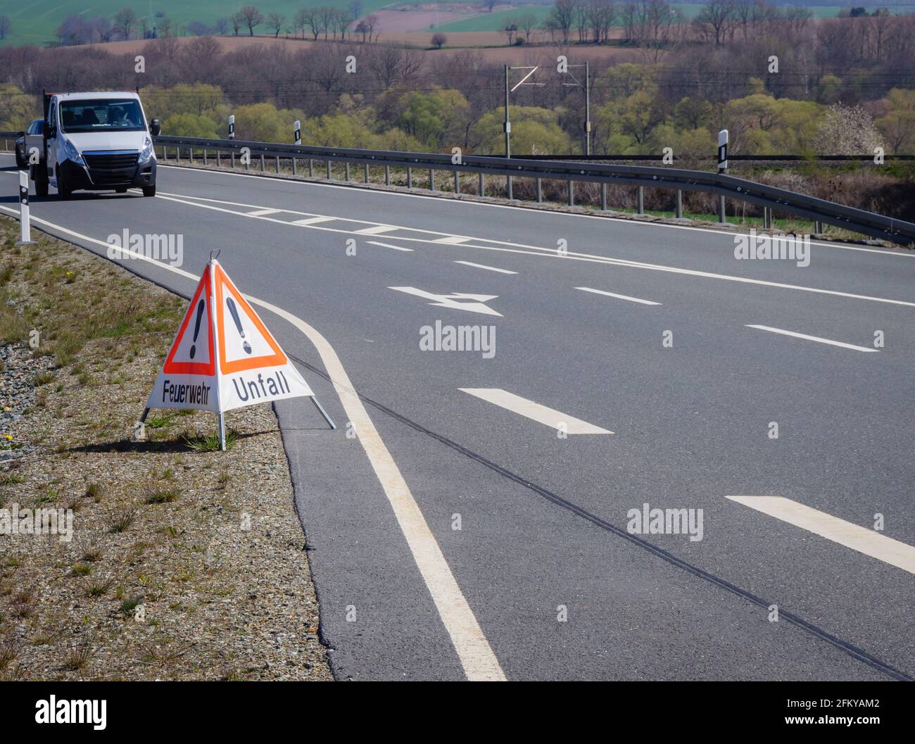 Caution traffic accident sign on the roadside Stock Photo - Alamy