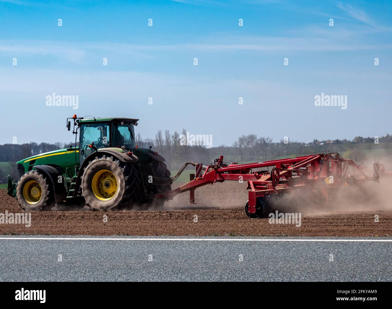 Red tractor plows field soil hi-res stock photography and images - Alamy