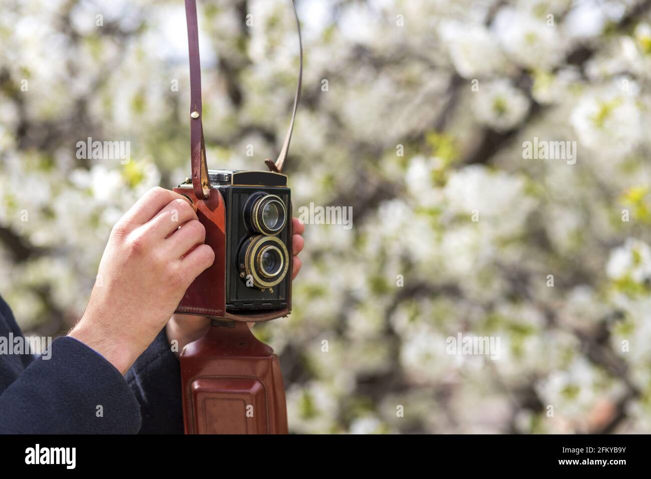 Person using an old vintage camera to take pictures Stock Photo - Alamy