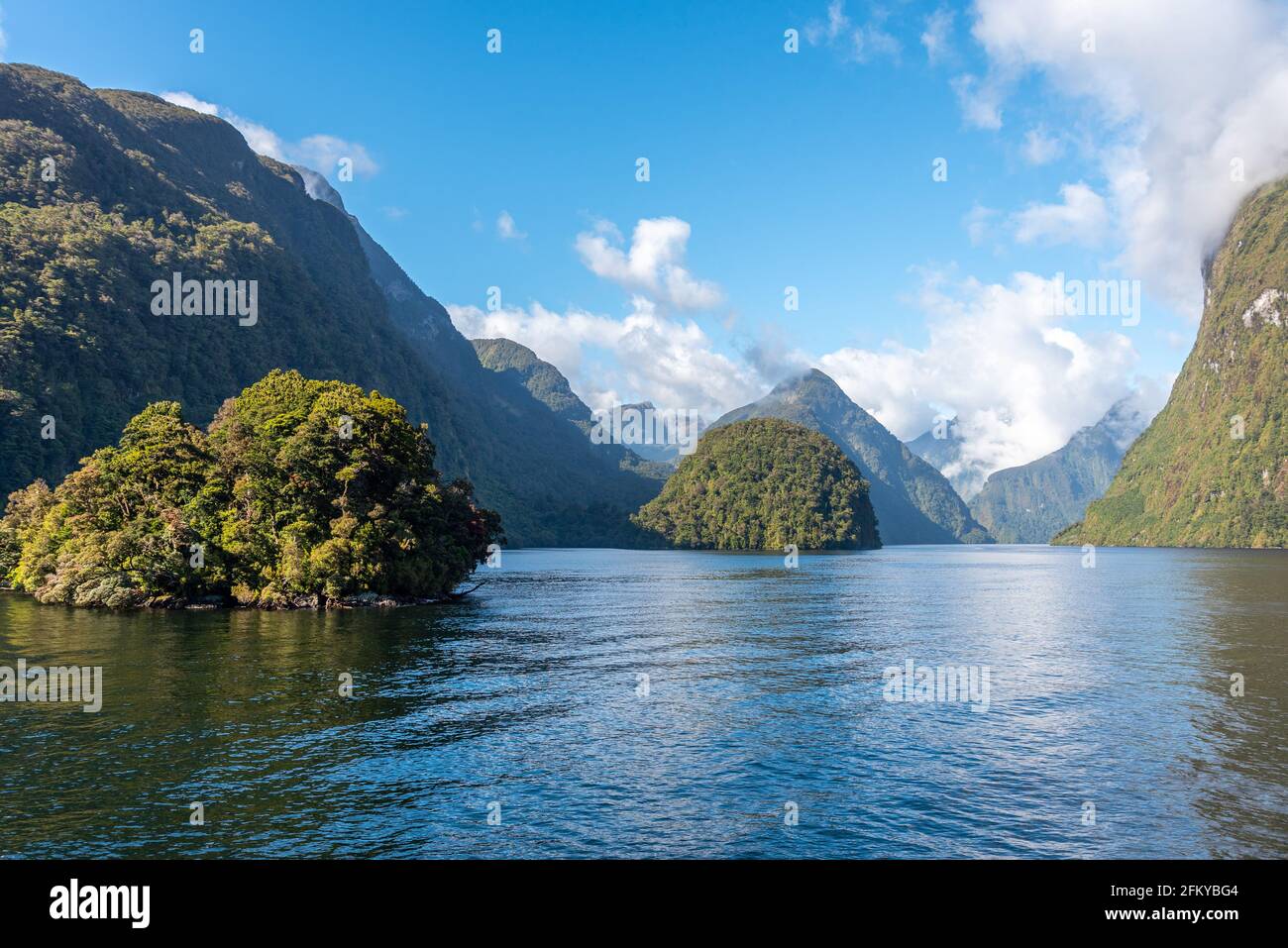 A new morning dawning at Doutful Sound, clouds hanging low in the ...