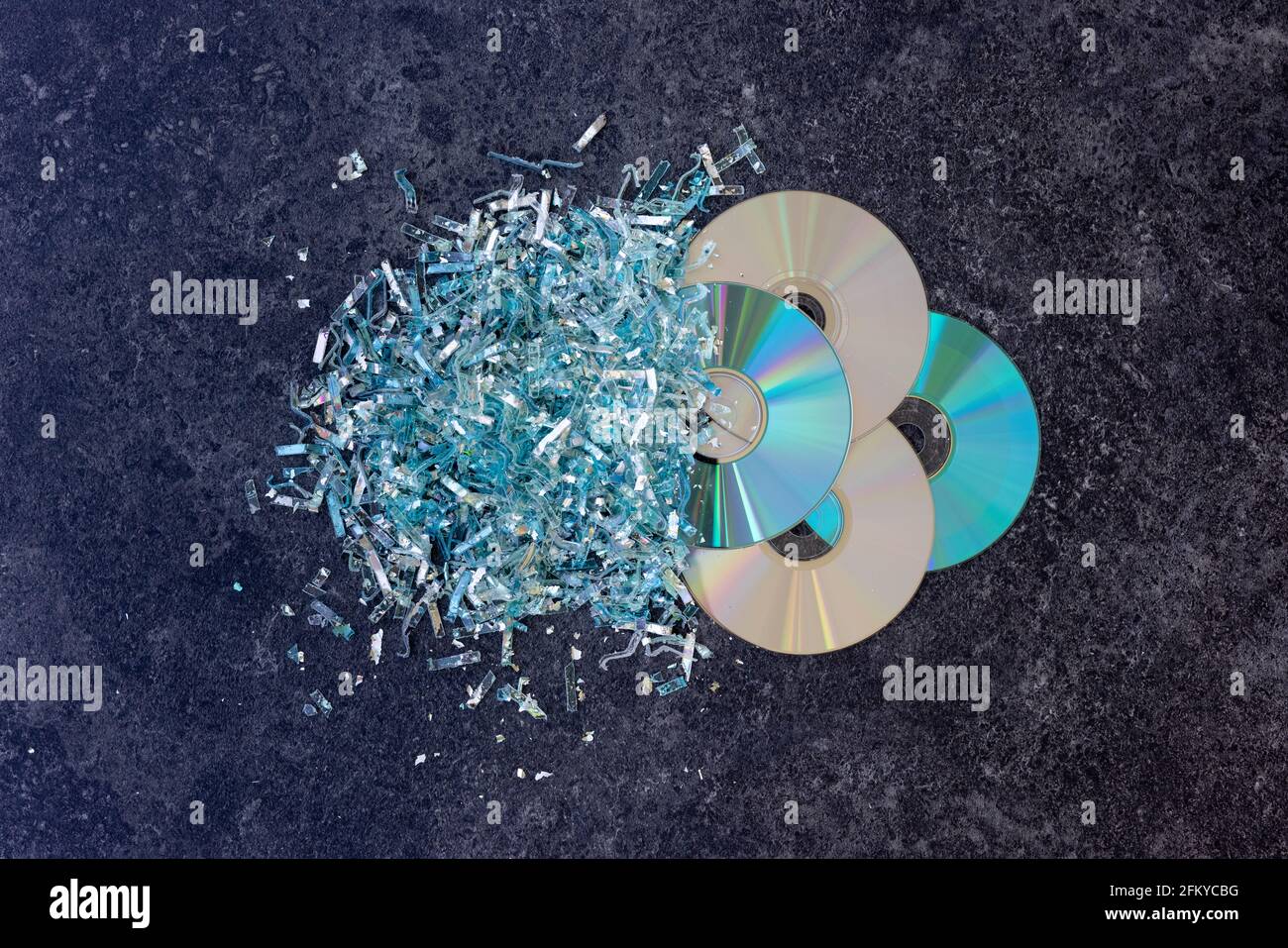 CDs and DVDs destroyed into small particles by means of shredder Stock ...