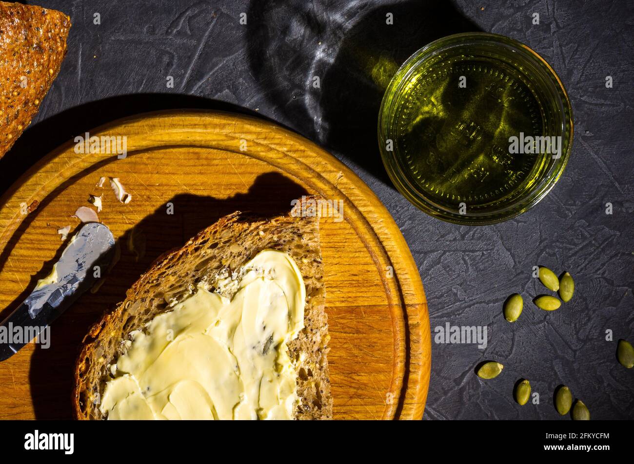 Slice of rustic natural yeast-free bread with flax, poppy seeds, sesame ...