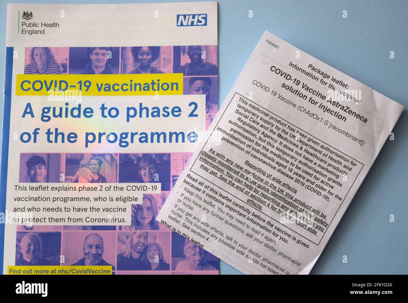 Covid-19 NHS vaccination programme leaflets on light blue background ...